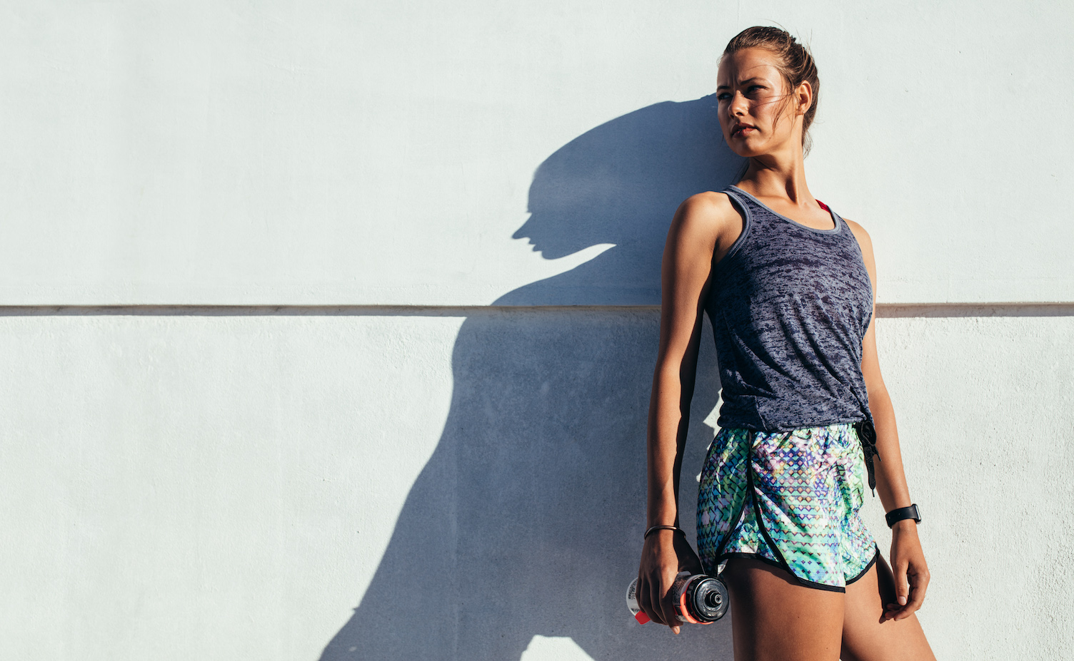 Female runner relaxing after workout. - Kirsten Murphy Makeup